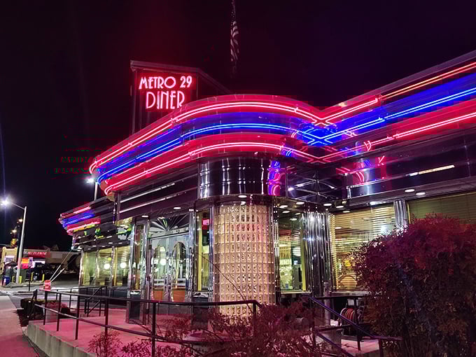 The neon-trimmed exterior of Metro 29 Diner glows like a beacon of hope for the hungry, a chrome-clad time machine promising comfort food salvation.