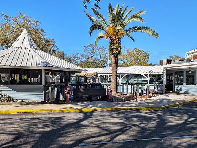 The unassuming blue exterior of Dixie Crossroads hides seafood treasures within, like a pirate's chest disguised as a beach cottage.