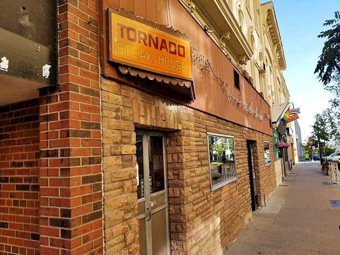 The unassuming exterior of Tornado Steak House beckons like a secret handshake. This brick-faced Madison institution doesn't need flashy signage to announce its carnivorous treasures within.