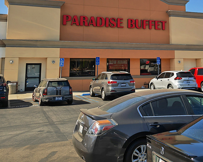 The bright red letters of Paradise Buffet stand out like a culinary lighthouse, guiding hungry travelers to this Montebello feast-haven.