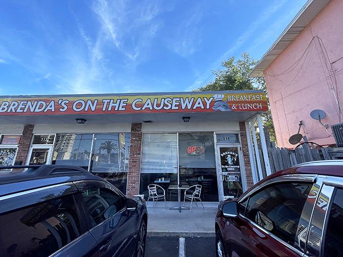 The unassuming exterior of Brenda's On the Causeway stands like a breakfast beacon along Dunedin's waterfront, promising simple pleasures within.