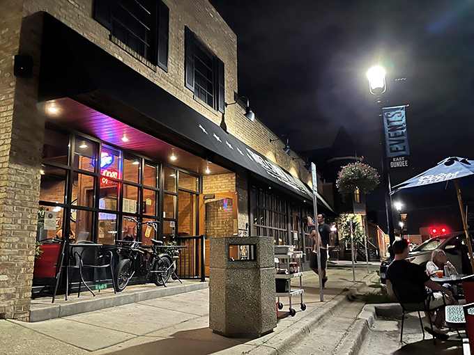 The unassuming brick exterior of River Street Tavern hides culinary treasures like a poker player concealing a royal flush. That orange door practically beckons you inside.