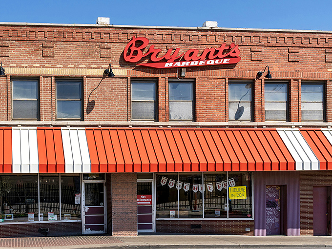 That iconic red script against brick isn't just a sign&mdash;it's a beacon calling barbecue pilgrims to one of Kansas City's most hallowed smoke temples. 