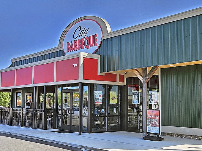 The red and green exterior of City Barbeque stands like a beacon of smoky promise. No fancy frills needed when what's inside speaks volumes.