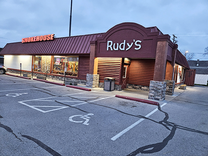 The unassuming exterior of Rudy's Smokehouse proves once again that the best barbecue joints rarely dress to impress. The smoke signals are in the air.