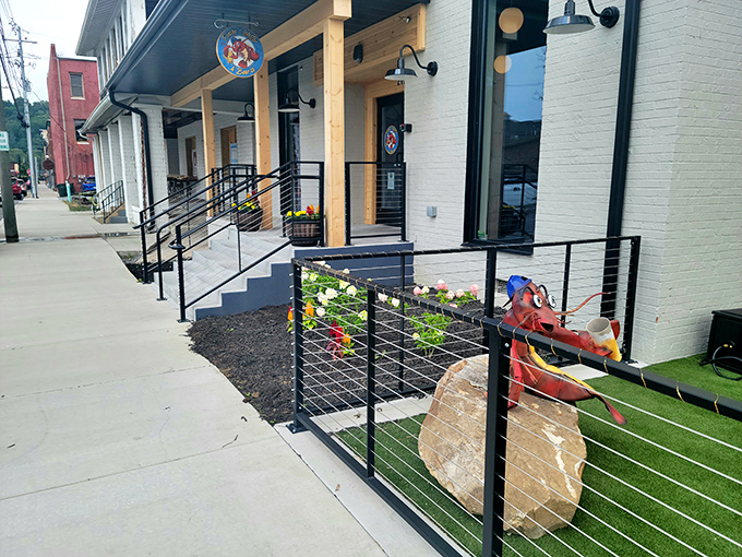 The evening glow transforms Pinchy's patio into a coastal retreat, complete with heat lamps and those iconic orange Adirondack chairs that practically whisper "relax and stay awhile."