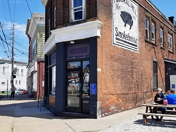 The unassuming brick corner that houses barbecue greatness. That painted pig logo isn't just decoration&mdash;it's a beacon calling hungry souls home.