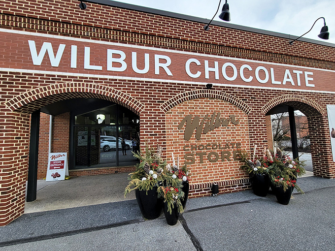 The brick facade of Wilbur Chocolate Store stands like a temple to cocoa worship, beckoning chocolate pilgrims with its timeless charm and promise of sweet revelations inside.