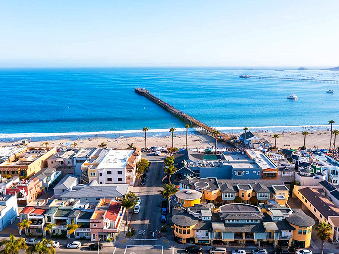 Avila Beach unfolds like a Mediterranean daydream, where golden hills embrace a perfect crescent of sand and sea. California coastal living at its most picturesque.
