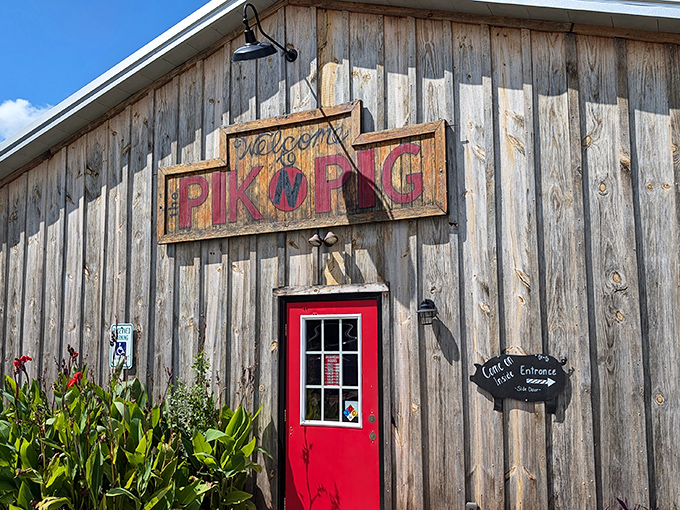 The weathered wooden exterior with that iconic red door isn't just inviting&mdash;it's practically whispering "get in here and eat something amazing."