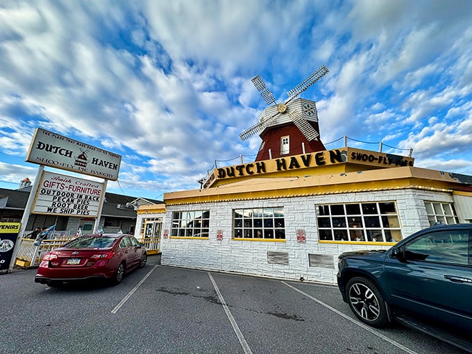 The iconic windmill of Dutch Haven stands proudly against the Pennsylvania sky, beckoning travelers with promises of sweet treasures within.