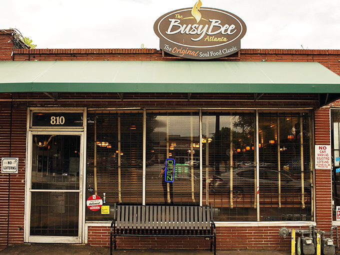 The unassuming brick exterior of Busy Bee Café hides Atlanta's soul food treasure – like finding the Hope Diamond in a paper bag.
