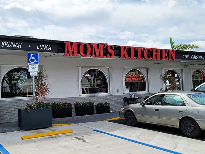 The iconic red lettering of Mom's Kitchen beckons like a lighthouse for the breakfast-starved. Come as a stranger, leave as family.