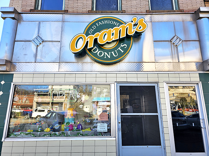 The iconic green and gold sign of Oram's beckons like a lighthouse for the sugar-deprived. This unassuming storefront has launched a thousand diet cheat days since 1938.