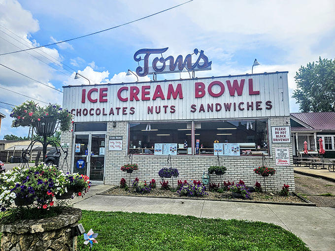 The unassuming yellow brick facade of Tom's Ice Cream Bowl stands as a time capsule of Americana, promising sweet treasures within those vintage walls.