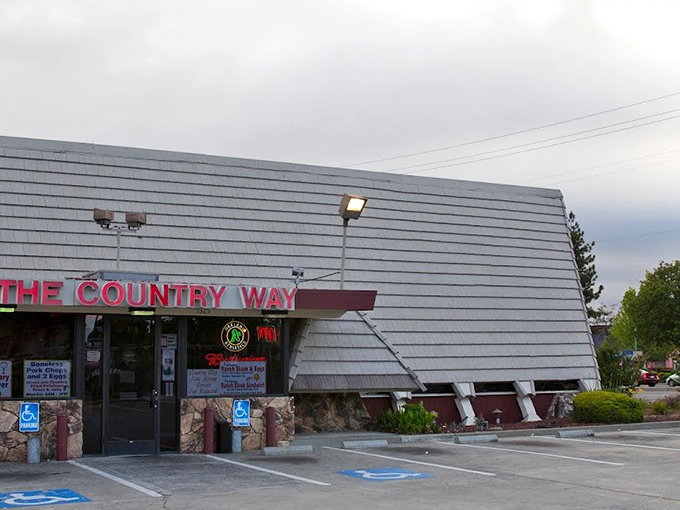 The unassuming exterior of The Country Way might not scream "culinary destination," but locals know those red trash cans guard a breakfast paradise worth finding.
