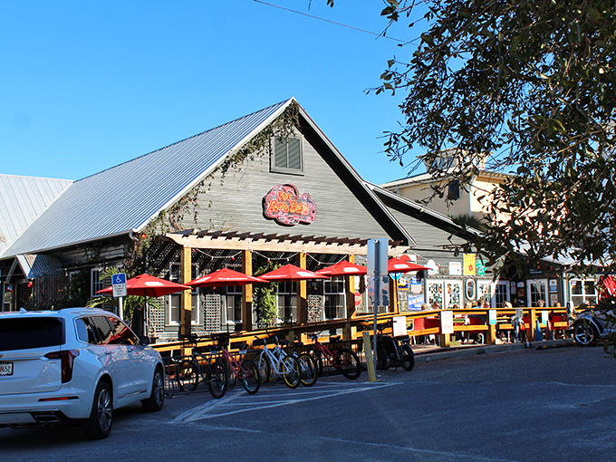The unassuming exterior of The RedBar hides a culinary wonderland within. Those red umbrellas are like beacons calling hungry travelers home.
