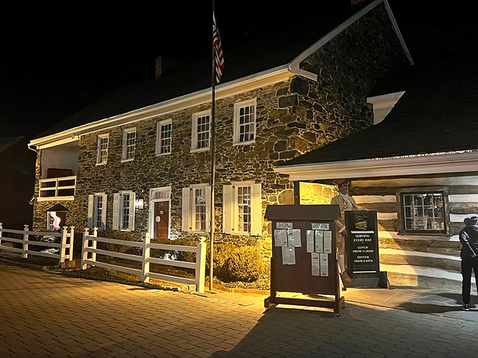 History stands sentinel at dusk as the Dobbin House Tavern glows with invitation, its fieldstone walls whispering revolutionary tales while promising modern culinary delights.