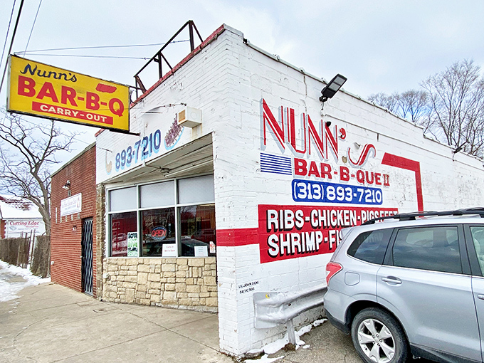 The bright yellow sign beckons like a culinary lighthouse in Detroit. This is where BBQ dreams and fried shrimp fantasies come true.