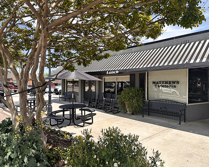 The unassuming storefront of Matthews Cafeteria beckons with Southern charm, rocking chairs patiently waiting for post-meal contemplation.