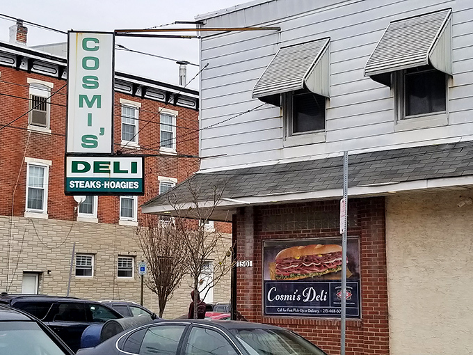 The iconic green and white sign beckons sandwich pilgrims like a hoagie lighthouse on South 8th Street. Philadelphia's sandwich history stands proudly on this corner.