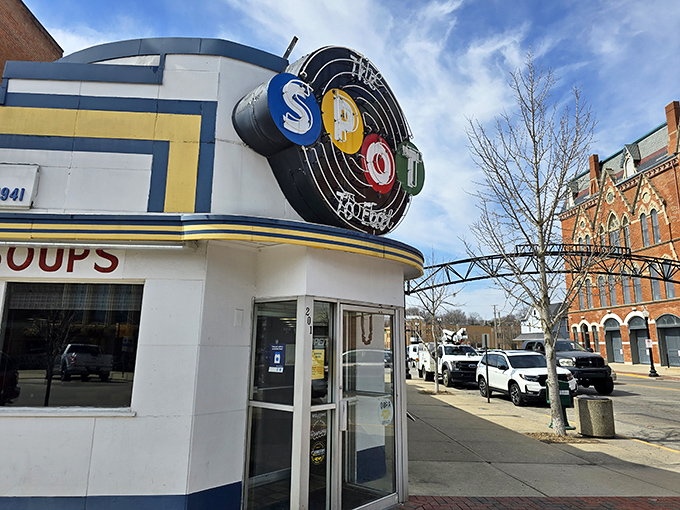 The blue and white Art Deco fa&ccedil;ade of The Spot stands proudly on Sidney's corner, its vintage neon sign beckoning hungry travelers like a culinary lighthouse.
