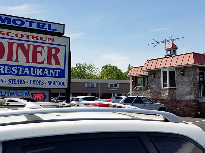The classic roadside sign beckons like an old friend, promising comfort food and a slice of Americana beneath that distinctive copper roof.