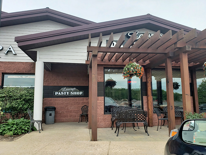 The unassuming exterior of Lawry's Pasty Shop stands like a culinary lighthouse, beckoning hungry travelers with the promise of Upper Peninsula comfort food perfection. 