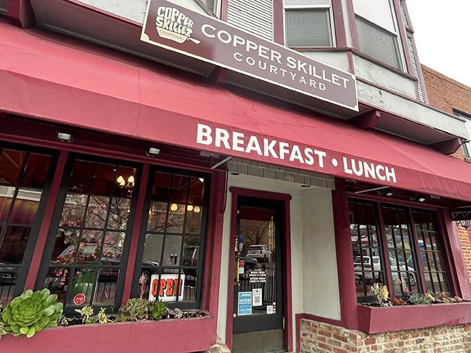 The crimson awning of Copper Skillet Courtyard beckons like a breakfast lighthouse guiding hungry souls through downtown Martinez.