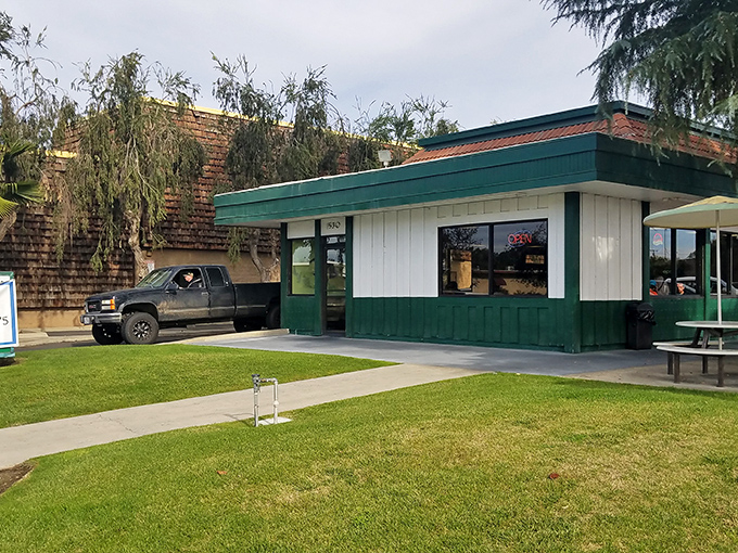 That green and white exterior isn't just charming &ndash; it's your first hint that serious comfort food awaits inside. 