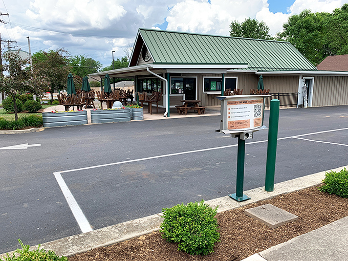 The Mug's inviting exterior with its bright red umbrellas practically whispers, "Come sit a spell." Small-town charm with big-time flavor potential.