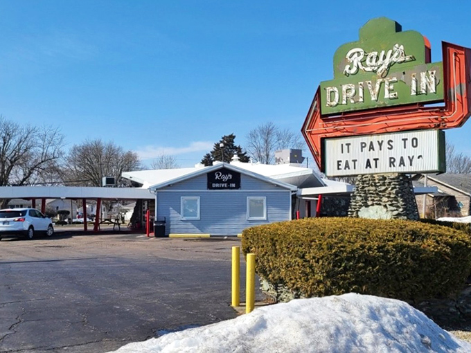 Classic drive-in charm meets modern convenience under these iconic red canopies that promise good times ahead.