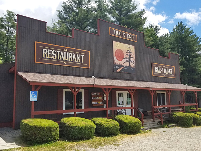Rustic charm meets culinary excellence at Trail's End, where towering pines stand guard over this unassuming treasure in Cooksburg's wilderness.