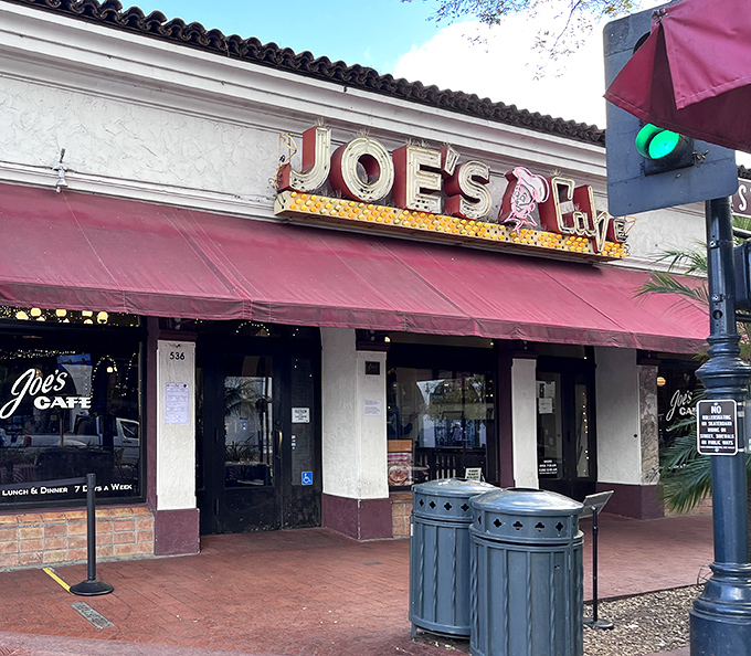 The iconic red awning of Joe's Cafe beckons hungry travelers on State Street like a culinary lighthouse guiding ships to delicious harbor.