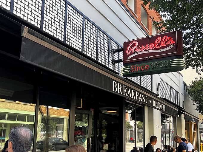 The iconic red neon sign beckons hungry Pasadenans like a breakfast lighthouse. Russell's storefront promises comfort and tradition on Fair Oaks Avenue.