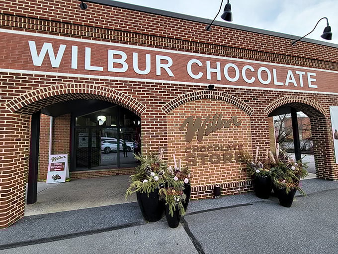 The brick facade of Wilbur Chocolate Store stands like a temple to cocoa worship, beckoning chocolate pilgrims with its timeless charm and promise of sweet revelations inside.