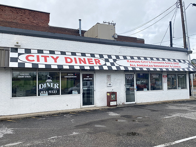 The classic black and white checkerboard awning of City Diner isn't just decoration&mdash;it's a beacon calling hungry souls to breakfast paradise in Kansas City.