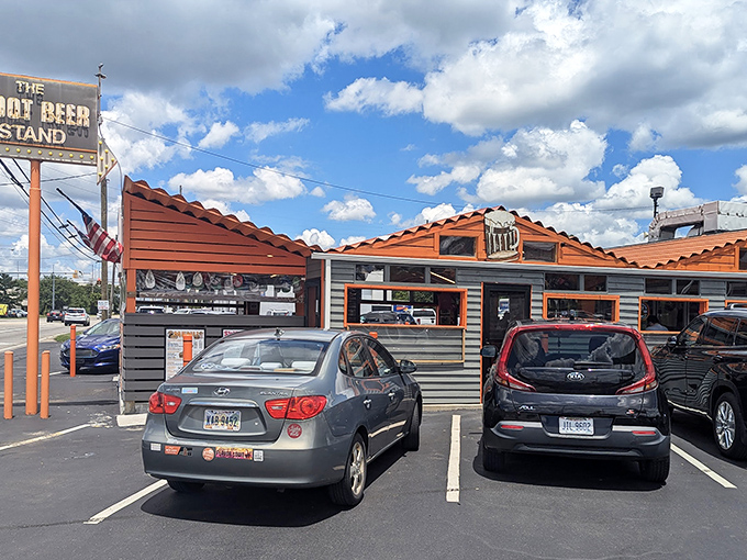 The iconic orange-and-brown exterior of The Root Beer Stand beckons like a time machine disguised as a roadside eatery. Nostalgia never tasted so good.