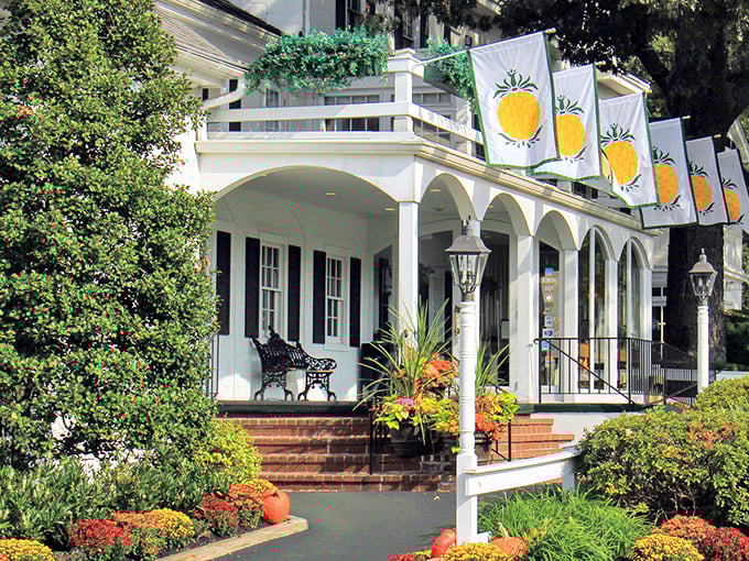 The colonial charm of William Penn Inn welcomes you with its pristine white facade, black shutters, and those cheerful pineapple flags&mdash;hospitality's universal symbol since before Instagram made food photos a sport.