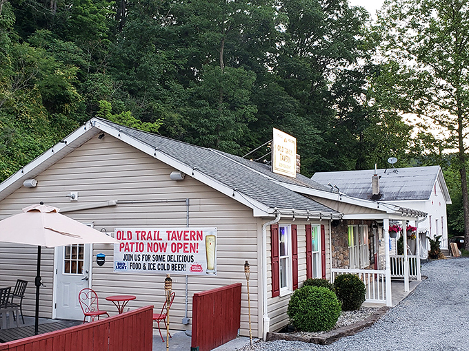 The unassuming exterior of Old Trail Tavern + Steak stands like a culinary lighthouse against the Pennsylvania hills, promising comfort and satisfaction to weary travelers.
