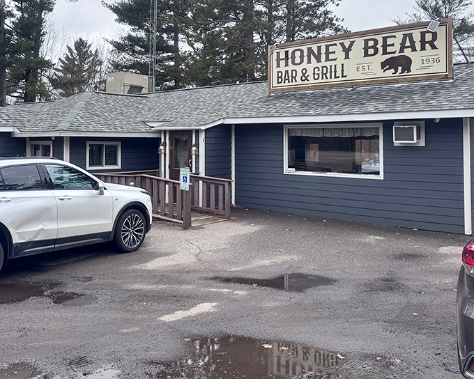 The guardian of good taste! A wooden black bear welcomes hungry travelers to this unassuming Northwoods gem where culinary treasures await.
