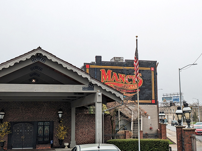 Mancy's iconic exterior stands as a beacon for steak lovers, where the neon sign has been guiding hungry Ohioans to beef paradise since 1921.