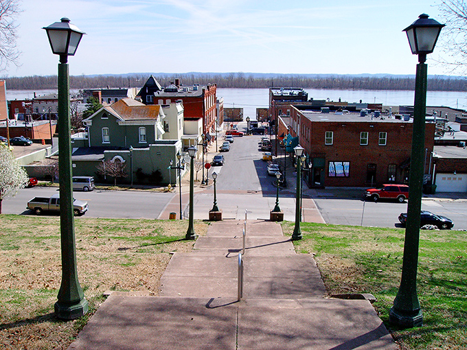 The view from the historic steps offers a postcard-perfect glimpse of Cape Girardeau's riverfront district, where the Mississippi meets Main Street charm.
