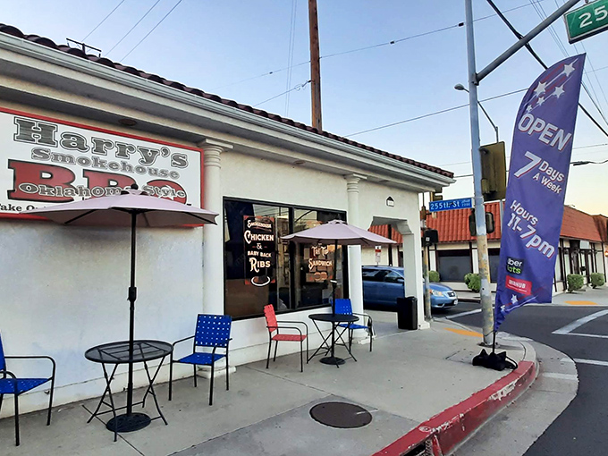 The unassuming storefront that launches a thousand road trips. Red umbrellas beckon like BBQ sirens calling you home.
