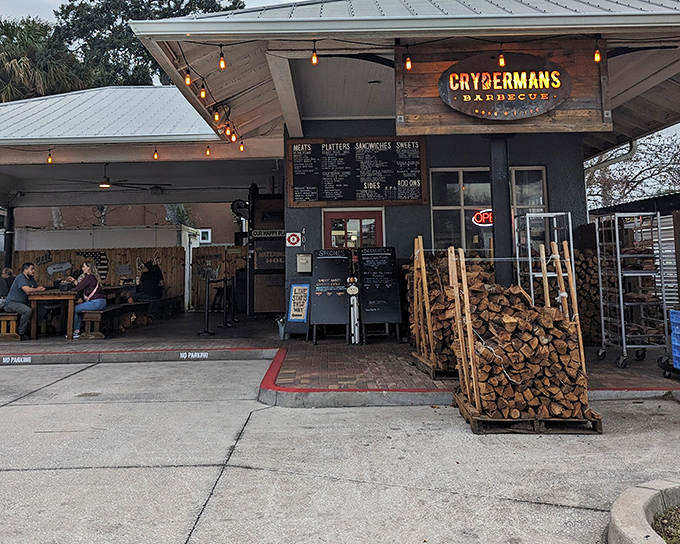 The barbecue beacon of Cocoa Village, with stacks of oak firewood that aren't just decoration—they're a promise of authentic, slow-smoked goodness to come.