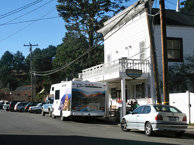 A quintessential small-town storefront that time forgot, where locals chat on porches and visitors wonder if they've stumbled onto a movie set.