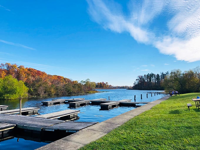 Nature's perfect mirror &ndash; Punderson Lake reflects autumn's fiery palette while boat docks patiently wait for the next adventure seeker.