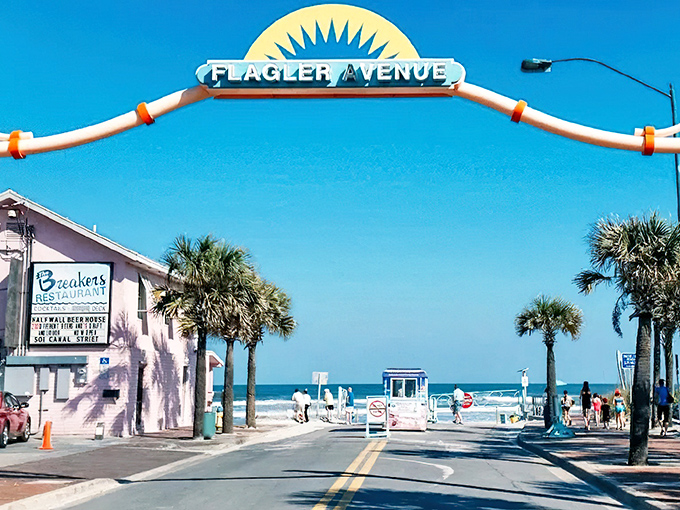 The iconic Flagler Avenue arch welcomes you to paradise, where Breakers Restaurant stands ready to satisfy post-beach cravings just steps from the Atlantic.