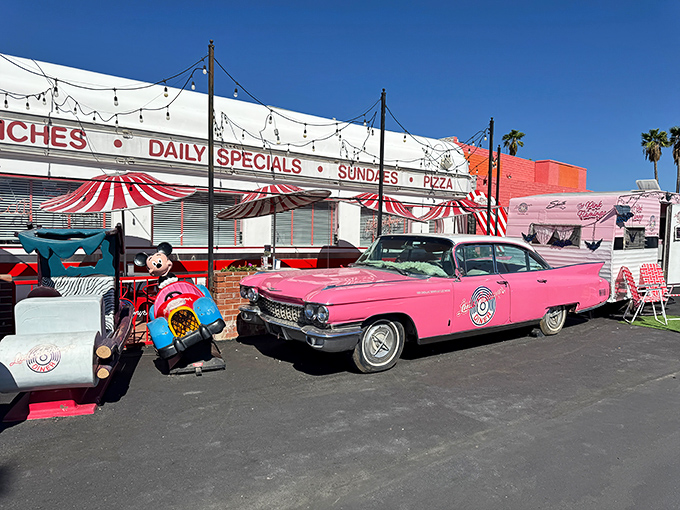 That pink Cadillac isn't just transportation&mdash;it's a time machine announcing your arrival to the 1950s. The ultimate greeting committee!