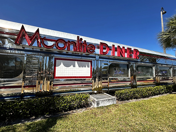 The gleaming stainless steel exterior of Moonlite Diner shines like a beacon of nostalgia under the Florida sun, promising comfort food and a trip back in time.